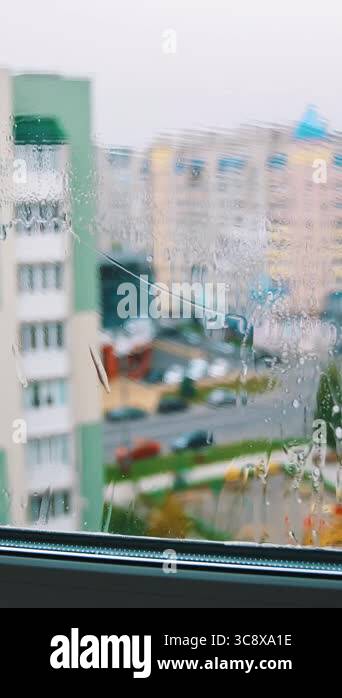 Water cleaner with wet glass. Close up view of cleaning wet window ...