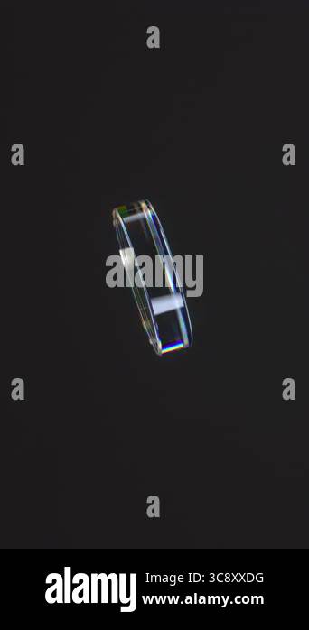 3d glass rotating cylinder with dispersion effect. Dark background ...