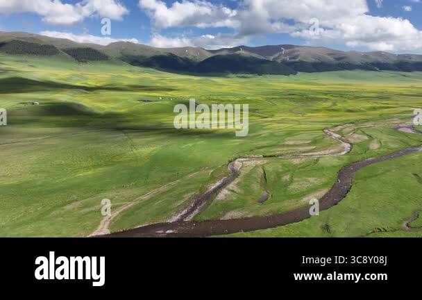 A view from a quadcopter of a river on the picturesque high-mountain ...