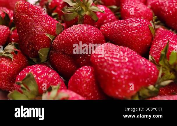 Bright fresh strawberries, showing off their juicy texture and bright ...
