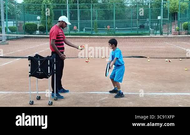Delhi, India, February 17, 2025 - Junior tennis players having coaching ...