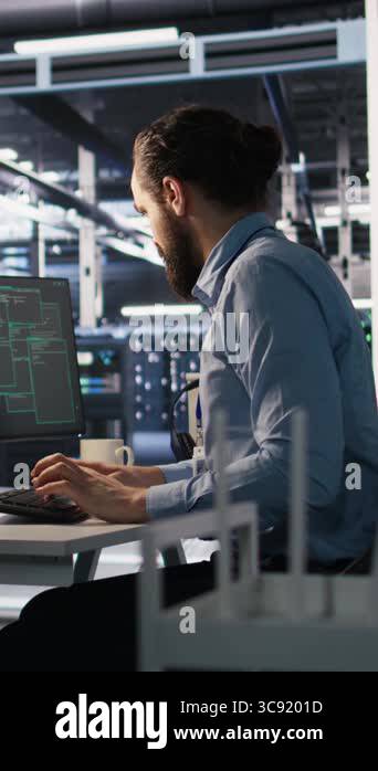 Vertical video Anxious technicians in data center reacting to system ...