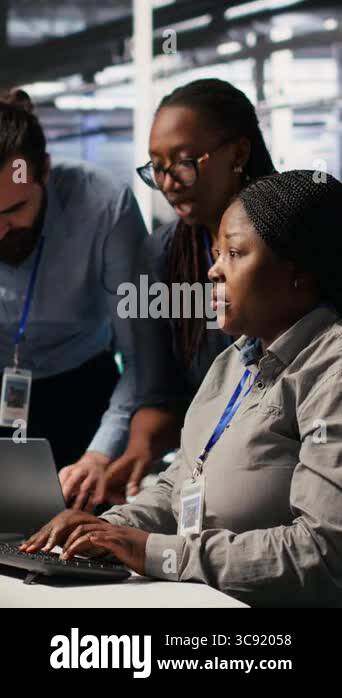 Vertical video Angry technicians in server room fighting each other ...