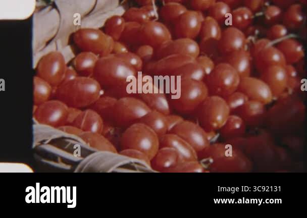 Vintage 8mm footage showcasing a rustic display of fresh pears, ripe ...