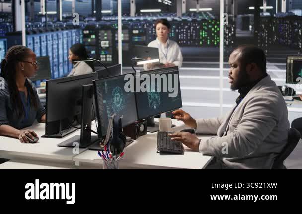 Stressed technician in data center managing AI server infrastructure ...