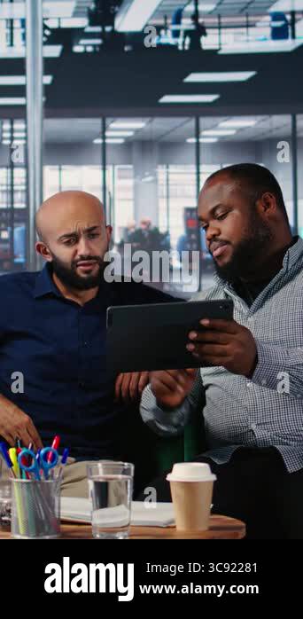 Vertical Video Office meeting featuring diverse professionals engaged ...