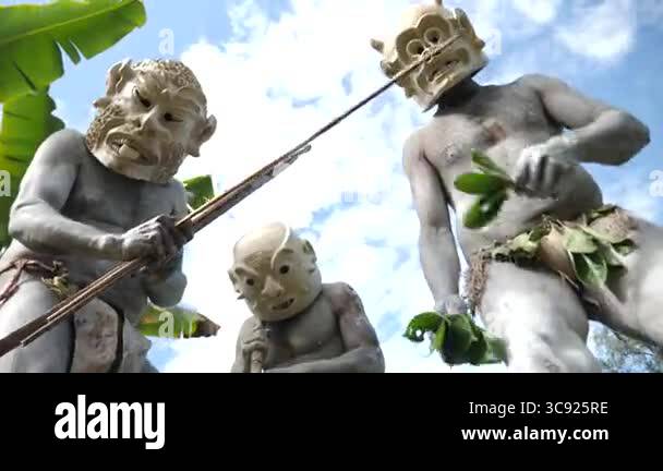 Asaro Mudmen tribe bow hunting. Papuan tribe dance. Mount Hagen tribe ...