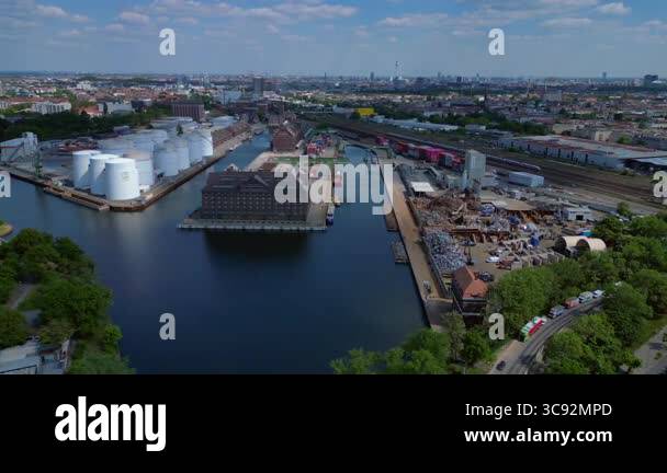 Aerial view of Berlin Westhafen industrial port with fuel storage tanks ...