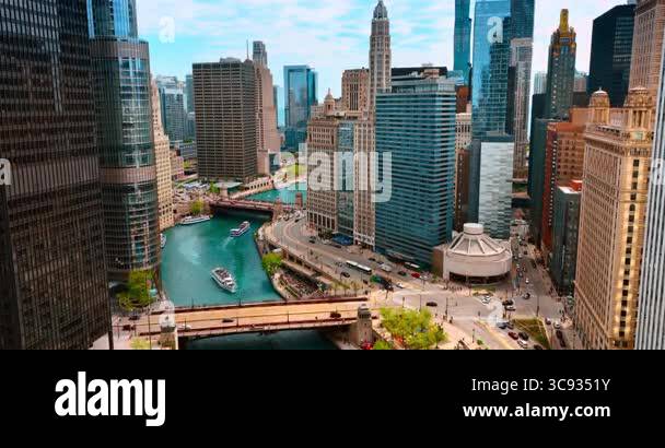 Lively atmosphere of the modern city at daytime. Drone rises above the ...