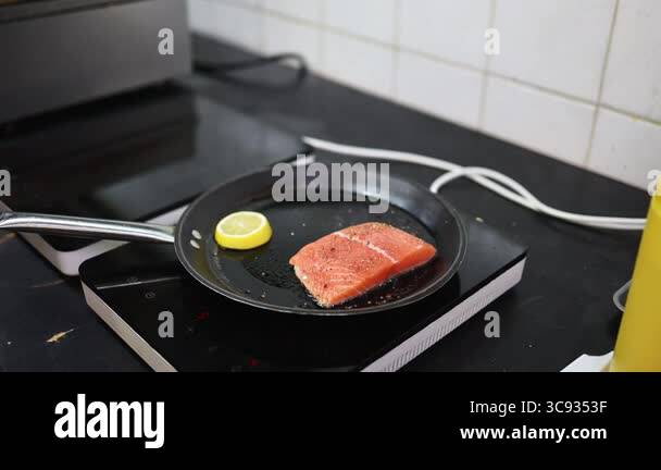 Close up of professional chef's hands working in restaurant kitchen. He prepares healthy ...