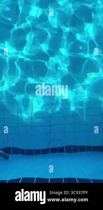 Sunlit water reflections in swimming pool Stock Video Footage - Alamy