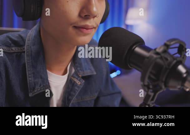 Extreme close-up of professional microphone in focus while a young ...