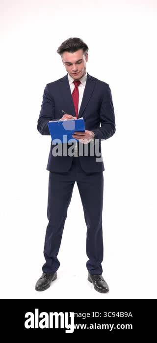 arrogant young businessman in navy blue suit making thumbs up gesture ...