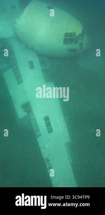 Submerged plane wreck visible underwater. Features the fuselage and ...