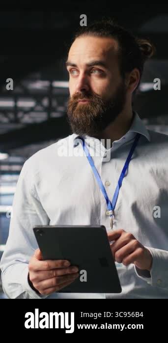 Vertical video Technicians on data center platform using devices to monitor neural network LLM ...