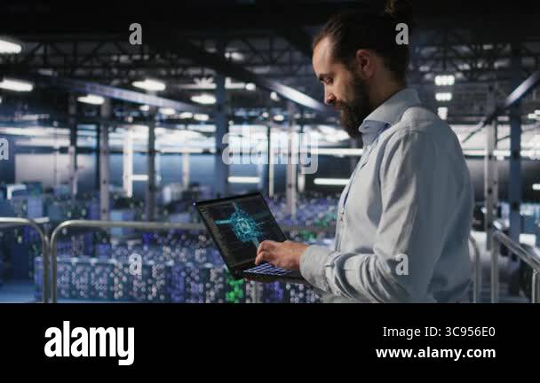Technician holding laptop walking on server farm platform, doing AI machine learning ...