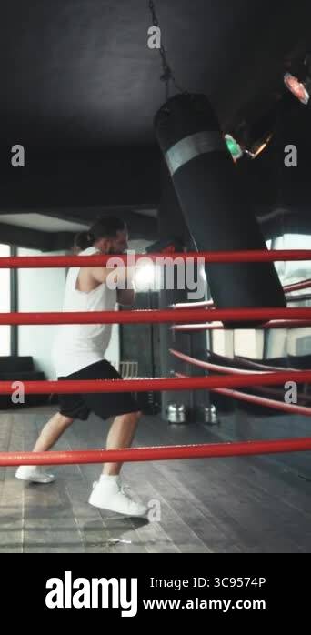 Vertical Video of Male Boxer enters the ring and prepares for the fight ...