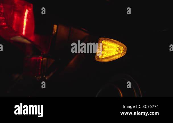 Closeup view of car rear light indicators illuminating brightly at ...