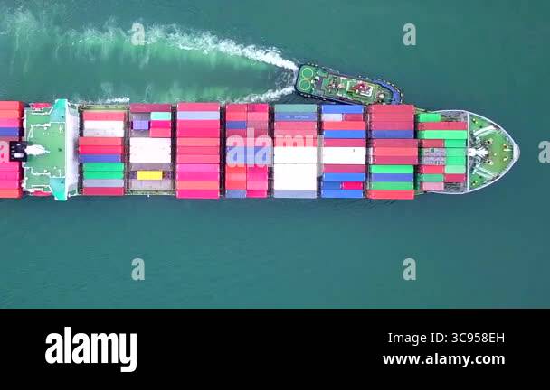 Cargo ships carry containers of goods to various destinations around ...
