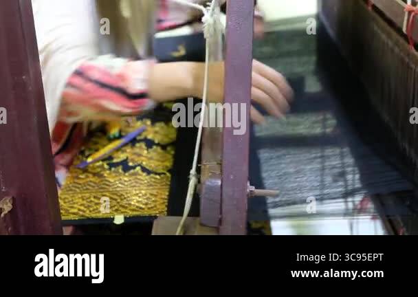Pekanbaru, Indonesia - February 26, 2025: Female weaver is weaving Riau ...