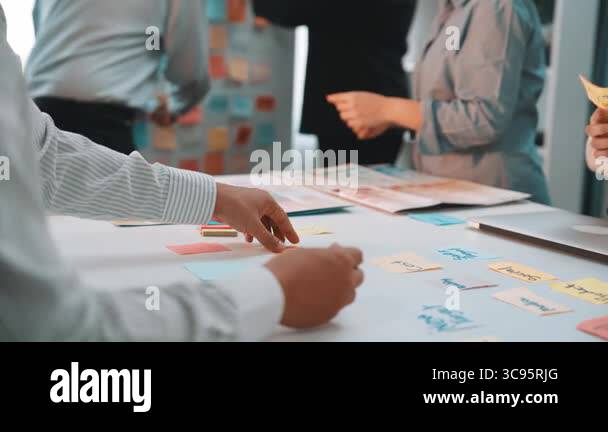 A dynamic business meeting showcases professionals engaged in ...