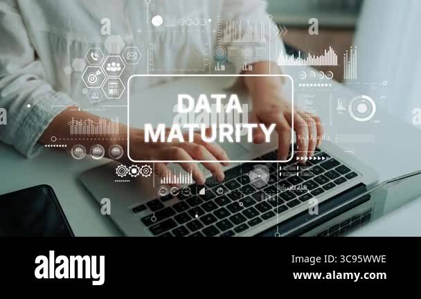 Hands Typing on Laptop with Digital Data Maturity Concept and Analytics Graphics Overlay in ...