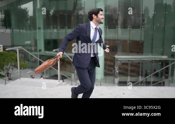 Successful business man celebrate for getting promotion while walking ...