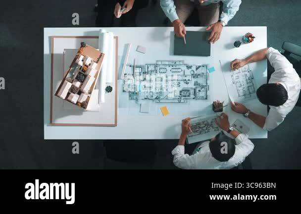 Top down aerial view of project manager using laptop to analysis ...
