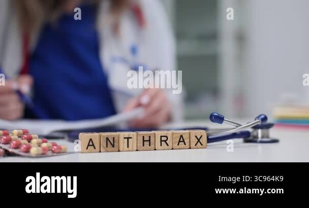 Word Anthrax on wooden cubes with pills and stethoscope in clinic ...