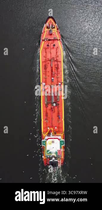 Top down view of a large cargo ship in sea. Logistics and transport ...