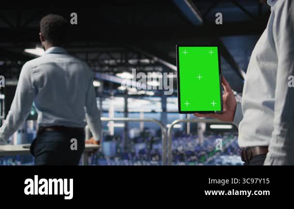 Close up of data center admin using mockup tablet to update storage ...
