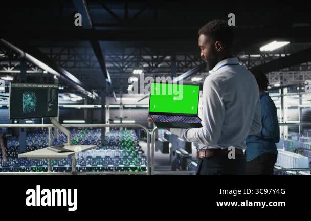 Data center programmers on industrial platform using green screen ...