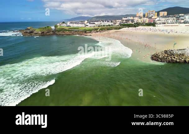 A stunning aerial shot captures a vibrant beach scene, showcasing ...