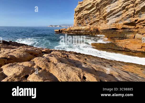 A stunning coastal scene showcases magnificent rocky cliffs alongside ...