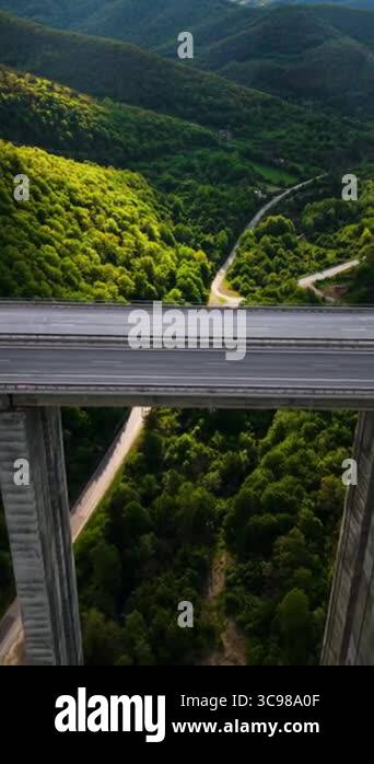 Aerial View of Transportation Truck Driving on Scenic Mountain Bridge ...