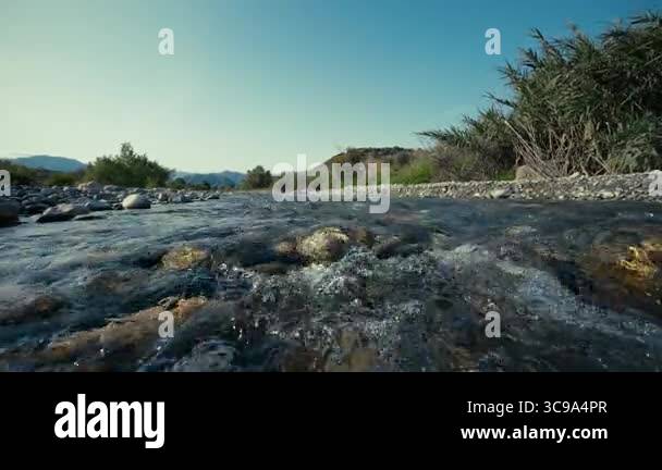 Stream Of Fresh Water Flowing On The Stones Stock Video Footage - Alamy