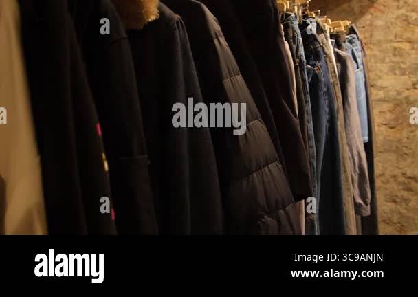 Clothes hanging in second hand store without people, concept of ...