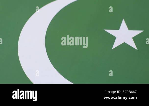 Pakistani flag, white crescent and white star on a green background ...