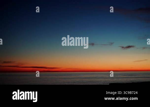 Seascape at evening, sunset over sea water. Night is falling. Nature ...