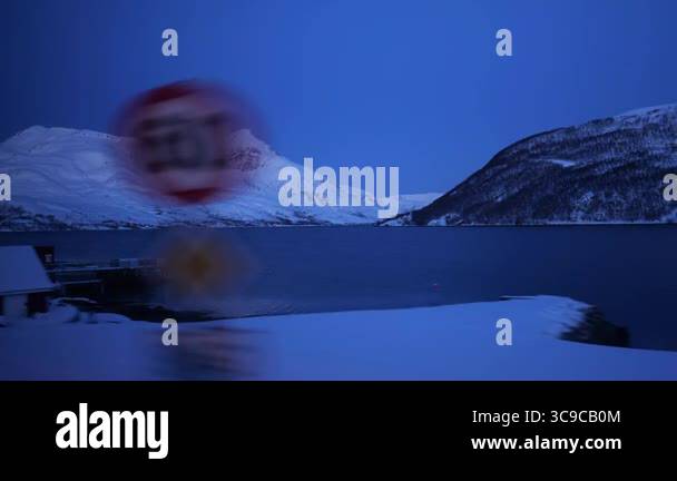 Driving by snowy arctic fjord, Kaldfjord in Tromso, Norway, rec709 ...