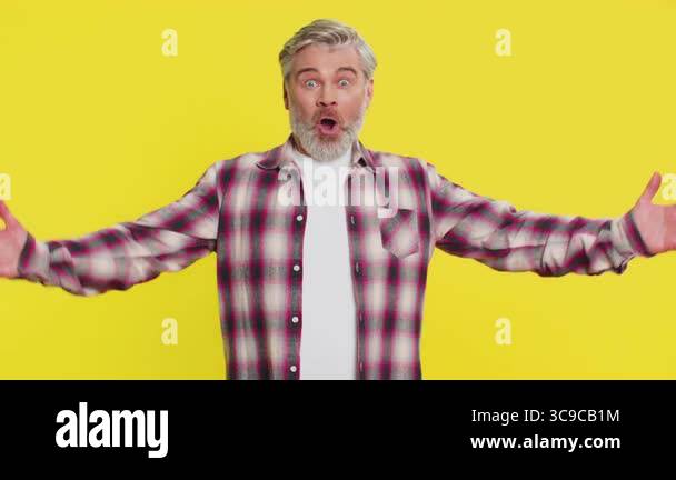 Mature man spreads arms wide, expressing heartfelt joy and delight for ...