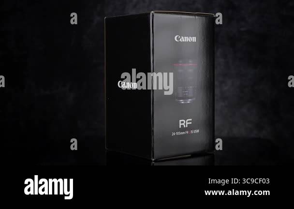 Canon RF 24 105mm f4 L IS USM lens in its box on a dark background ...