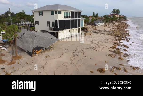 Ruined building in need of demolition or repair. Storm surge water and ...