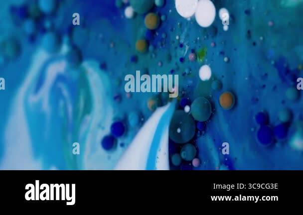 Vertical video. Colorful flow. Bubble paint. Water oil fluid mix ...
