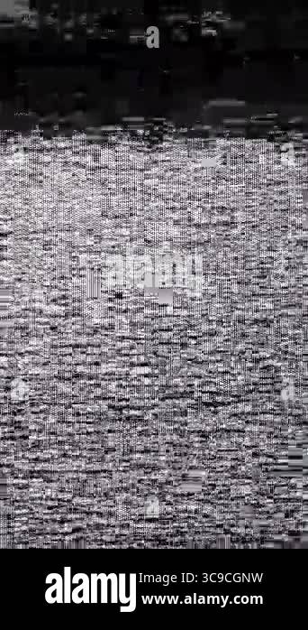 Grainy VHS footage with signal loss and tape noise artifacts creating a ...