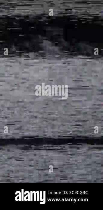 A vintage VHS tape playback glitch featuring horizontal static lines ...