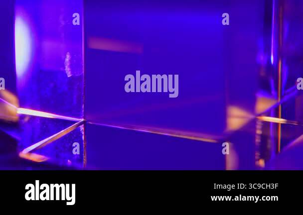 An abstract image showcasing a glass prism with vibrant pink and blue ...