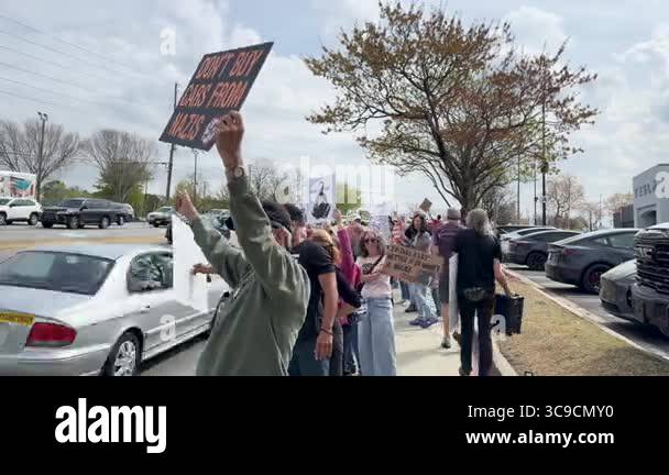 Duluth, GA / USA March 29, 2025: People hold signs making Nazi ...