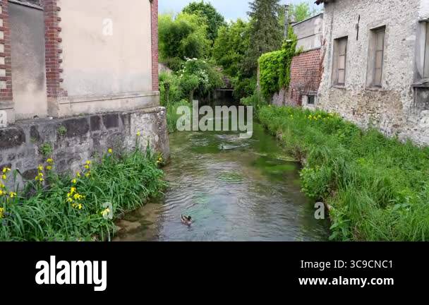 Provins, France - May 12, 2025: Beautiful river, Voulzie river, and ...