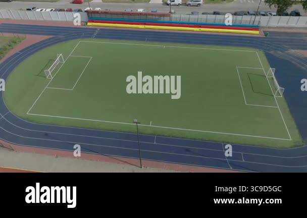 Football Field with Running Track in Public Sports Complex. High ...